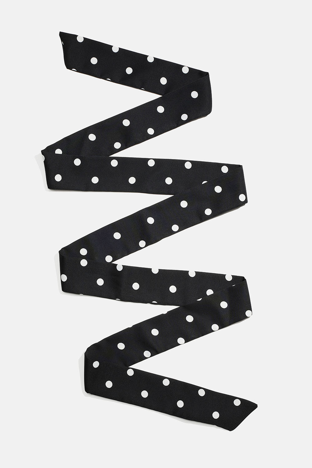 Smalt, svart skjerf med hvite prikker